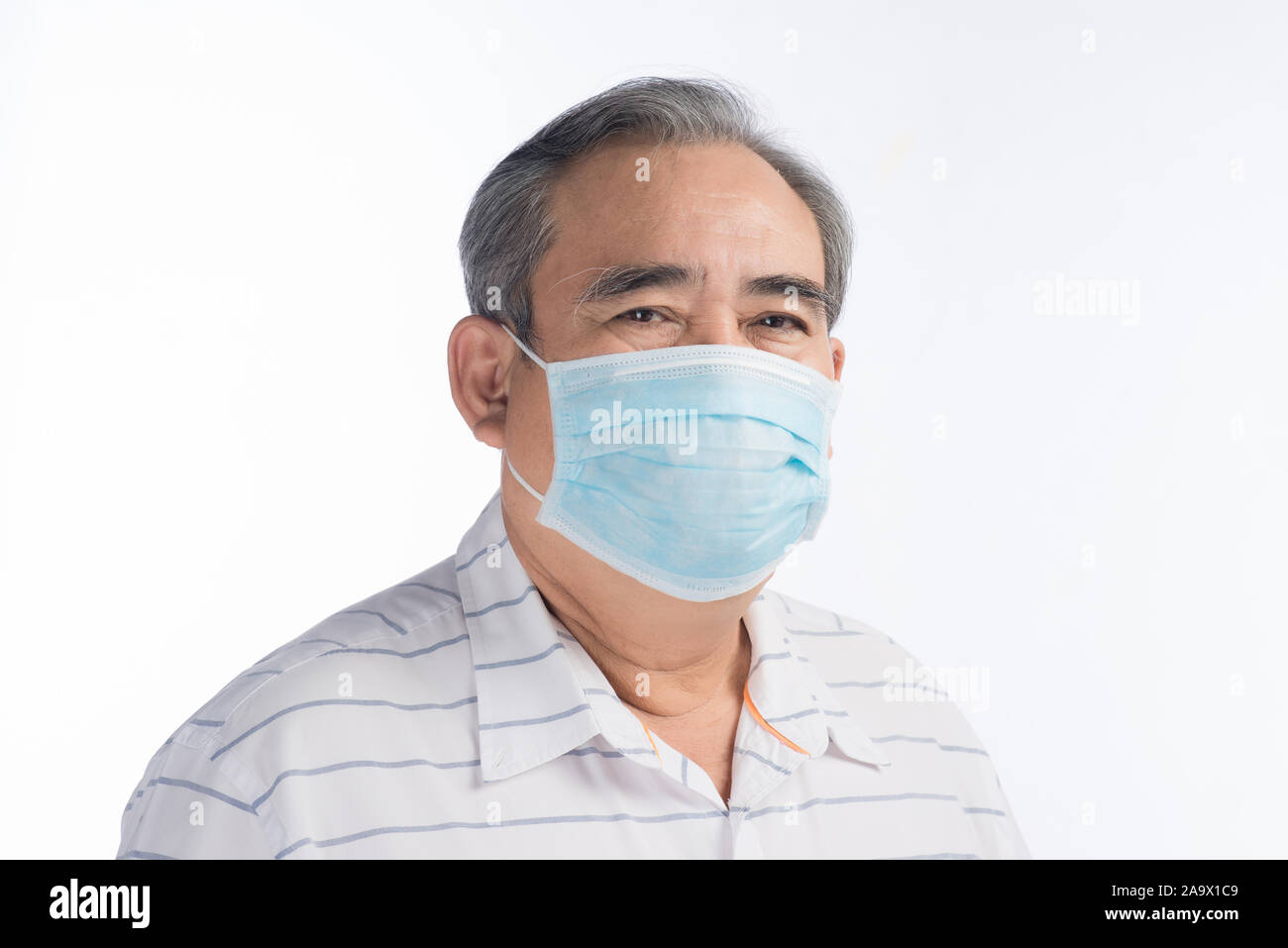 Asian senior man wearing face mask isolated on white background ...