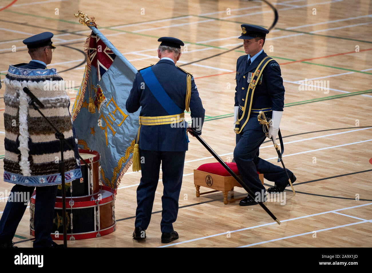 The Prince of Wales presents the new Queen's colours during a ceremony ...