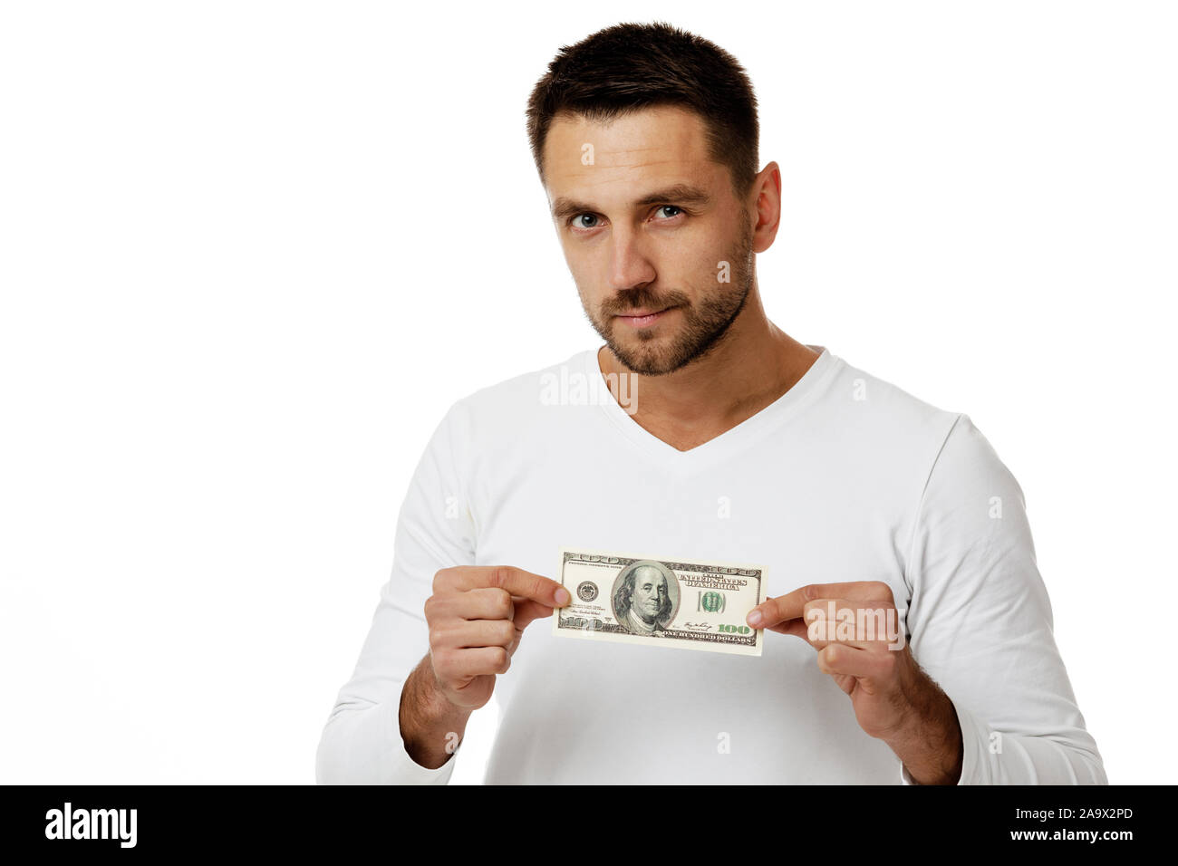 Portrait of young man holding money banknotes isolated on white ...