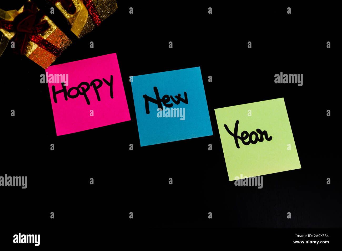 Writing Happy New Year on colorful sticky notes Stock Photo - Alamy