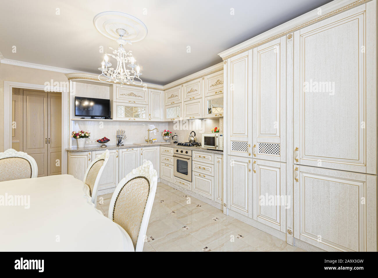 Luxury modern beige and cream colored kitchen interior Stock Photo - Alamy
