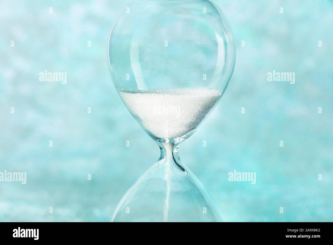 Time is running out concept. A close-up of an hourglass with sand ...