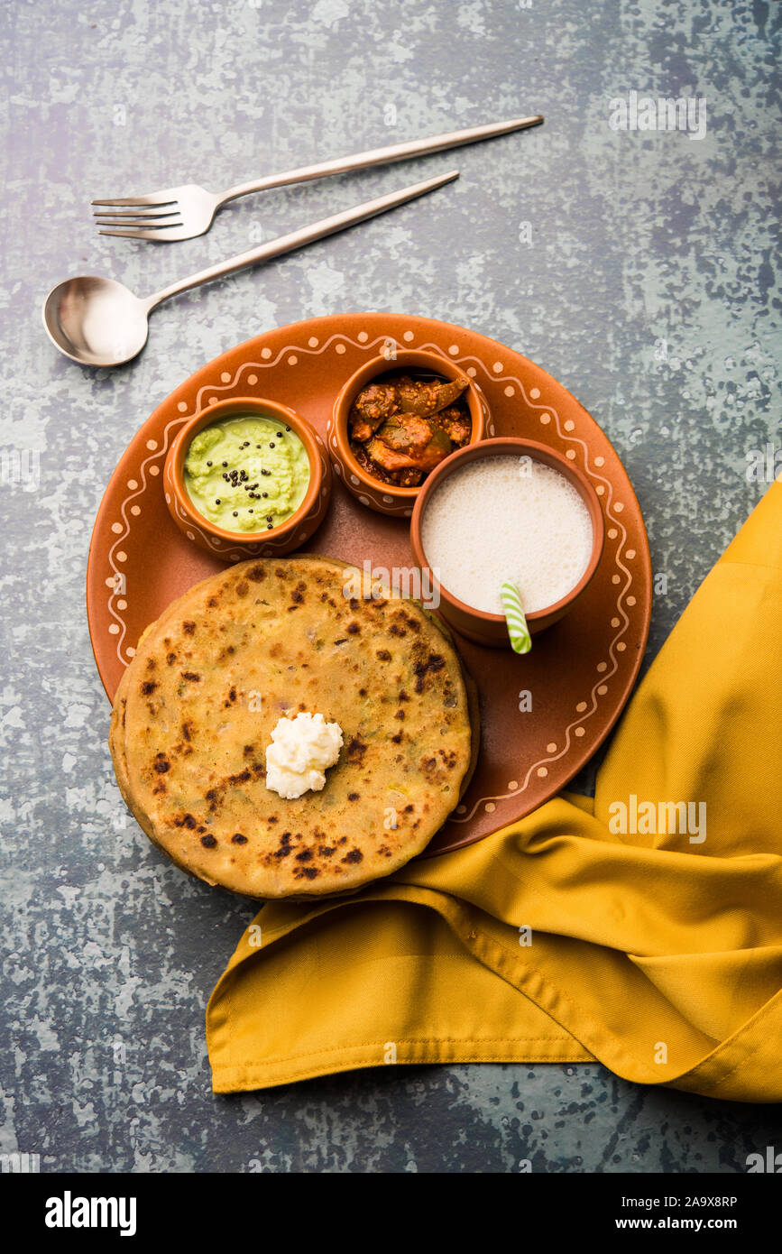 Aloo Paratha / Indian Potato stuffed Flatbread with butter on top ...