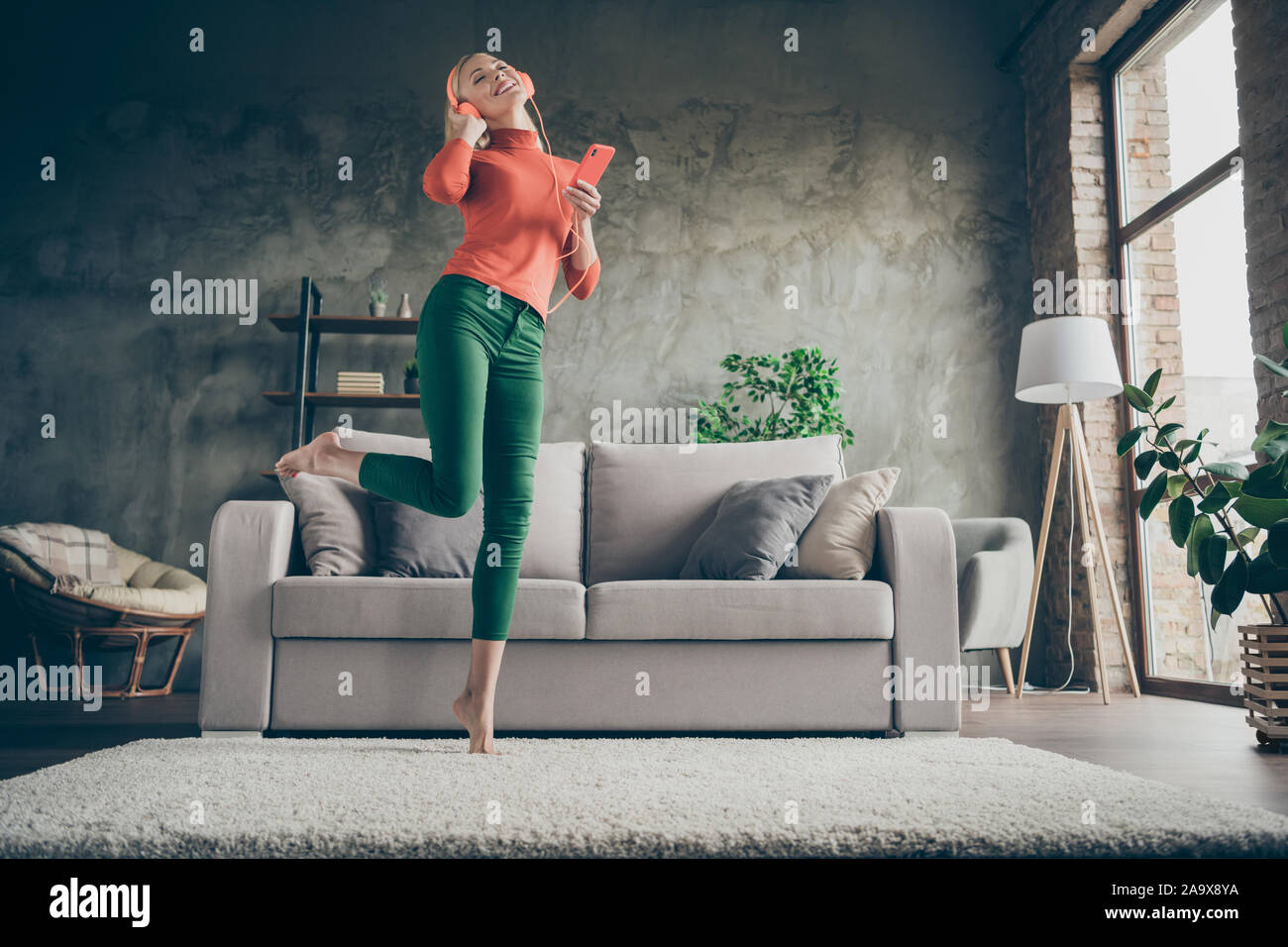 Full body low below angle view photo of pretty lady holding telephone ...