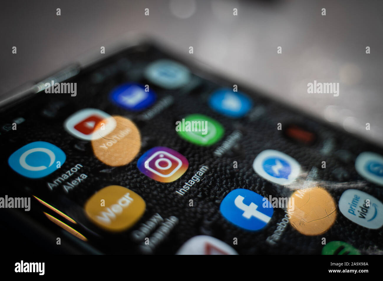A smartphone screen with many social media and essential applications ...