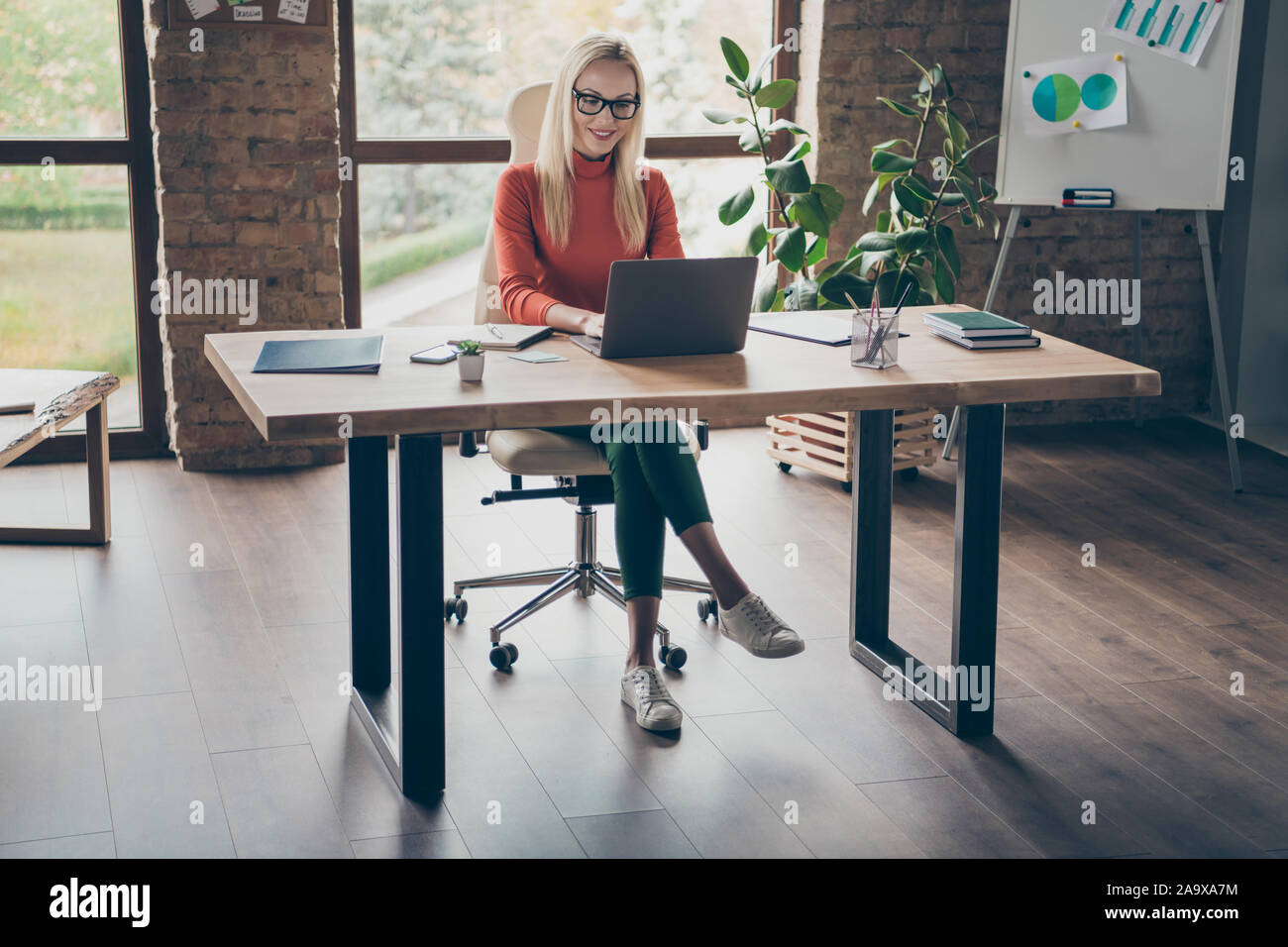 Full body photo of successful charming woman company owner sit table ...