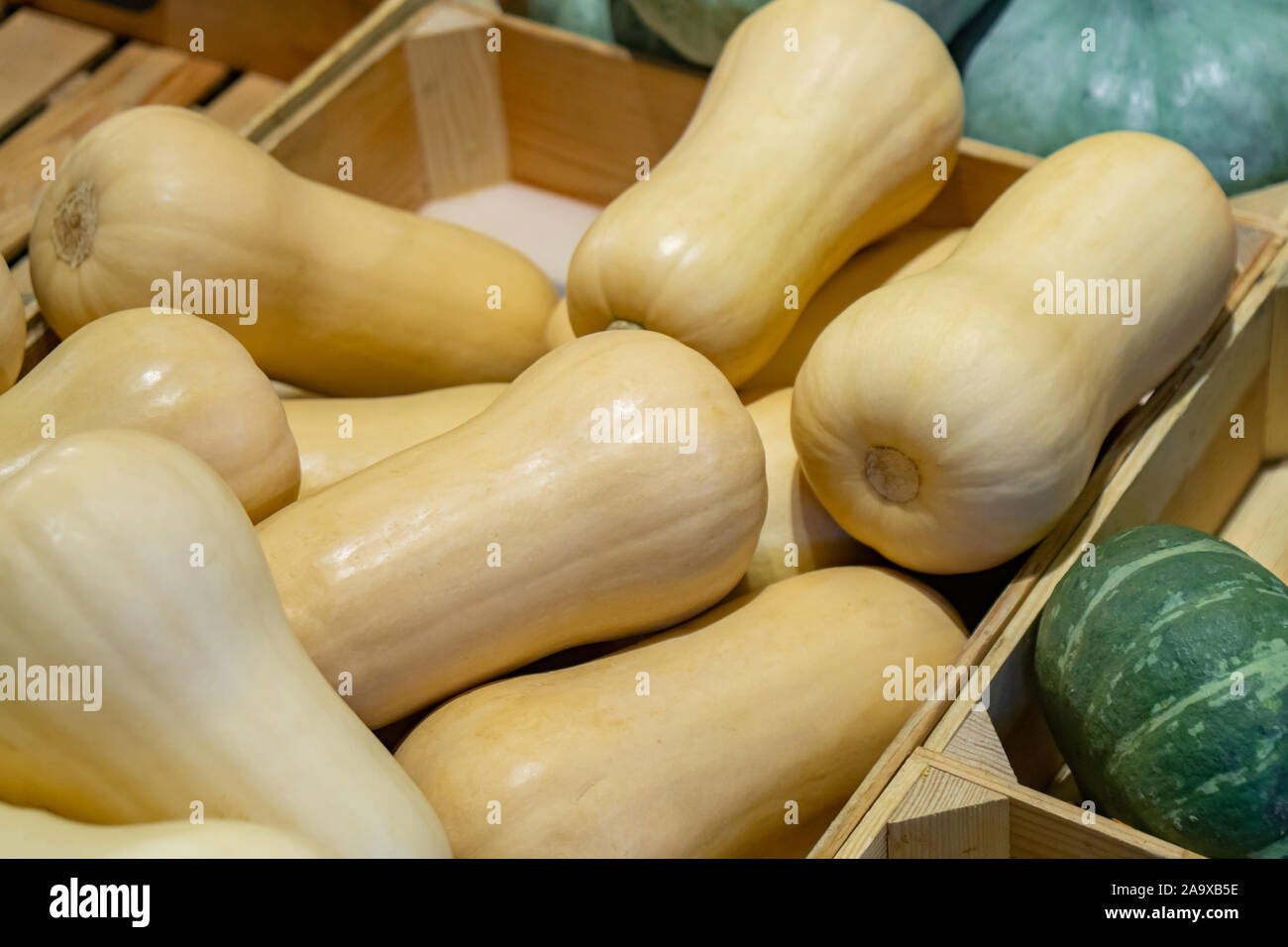 Fresh pumpkin on display in the grocery store. Fruit and vegetable ...
