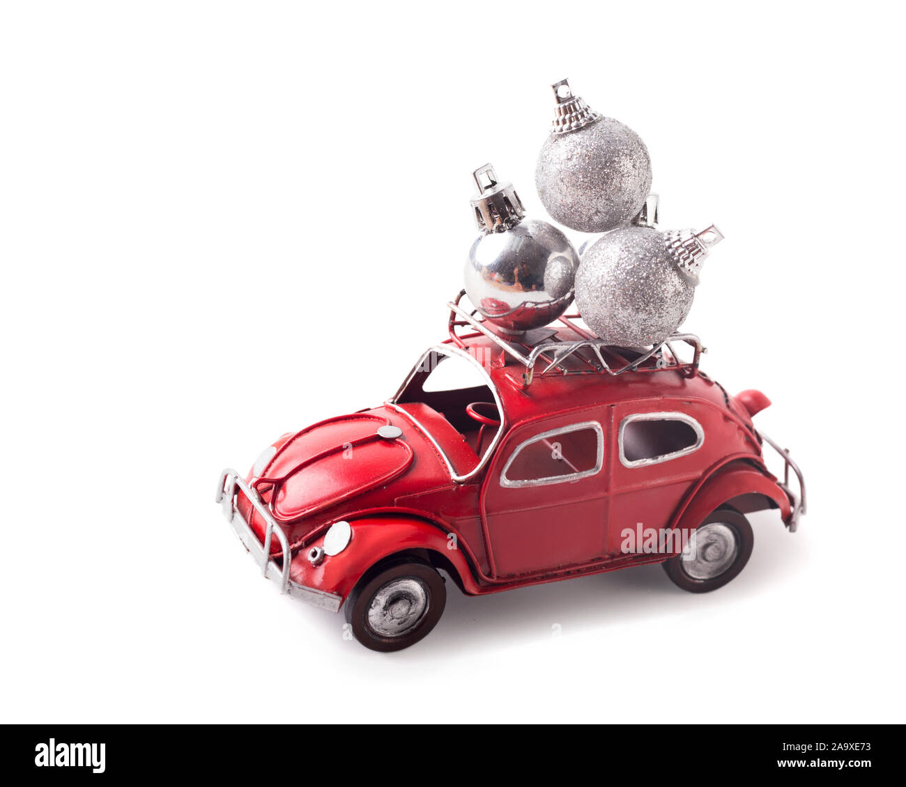 Retro car Volkswagen Beetle with silver decoration balls on white ...