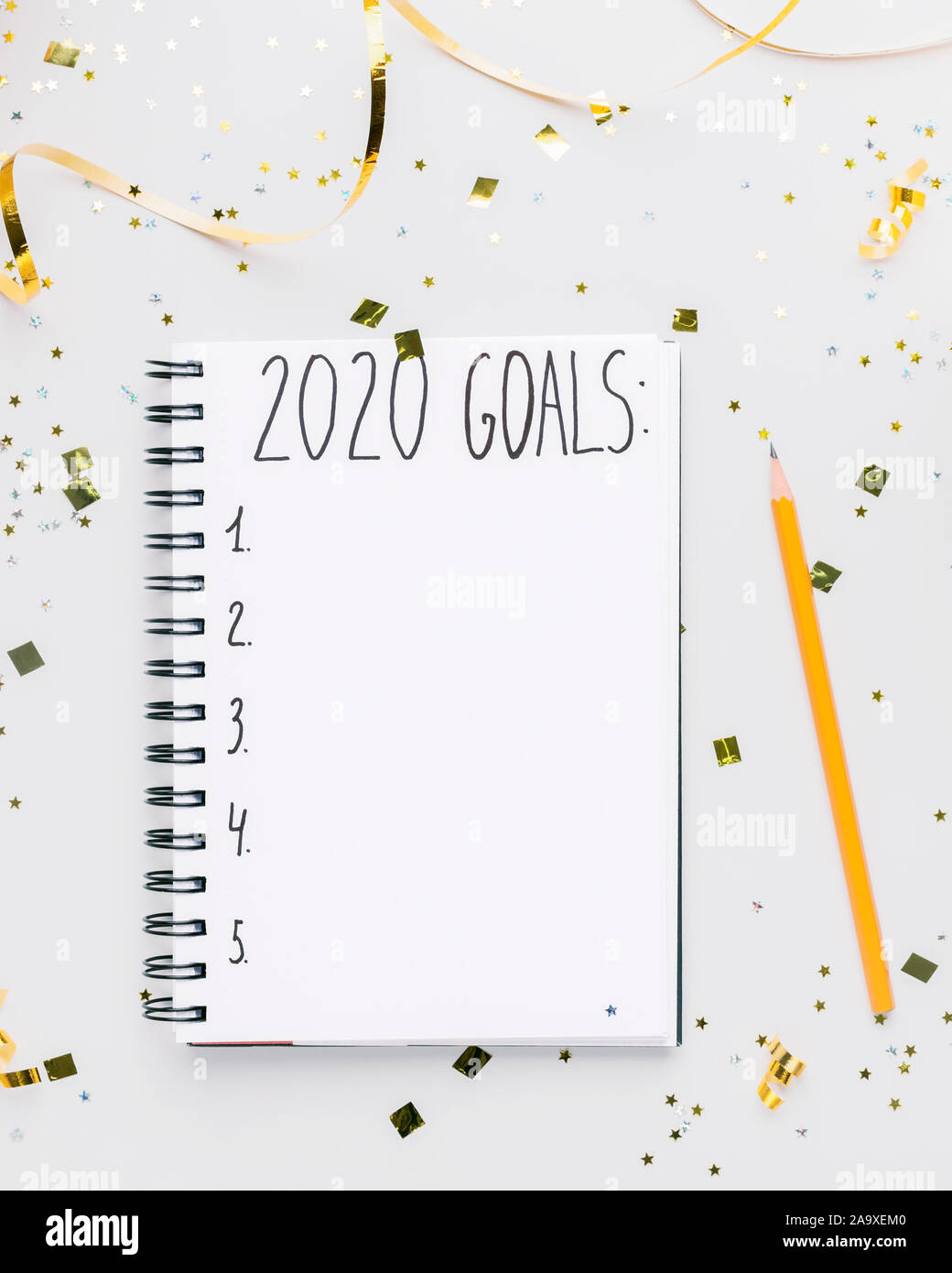 2020 goals list in notebook on background with gold confetti Stock ...