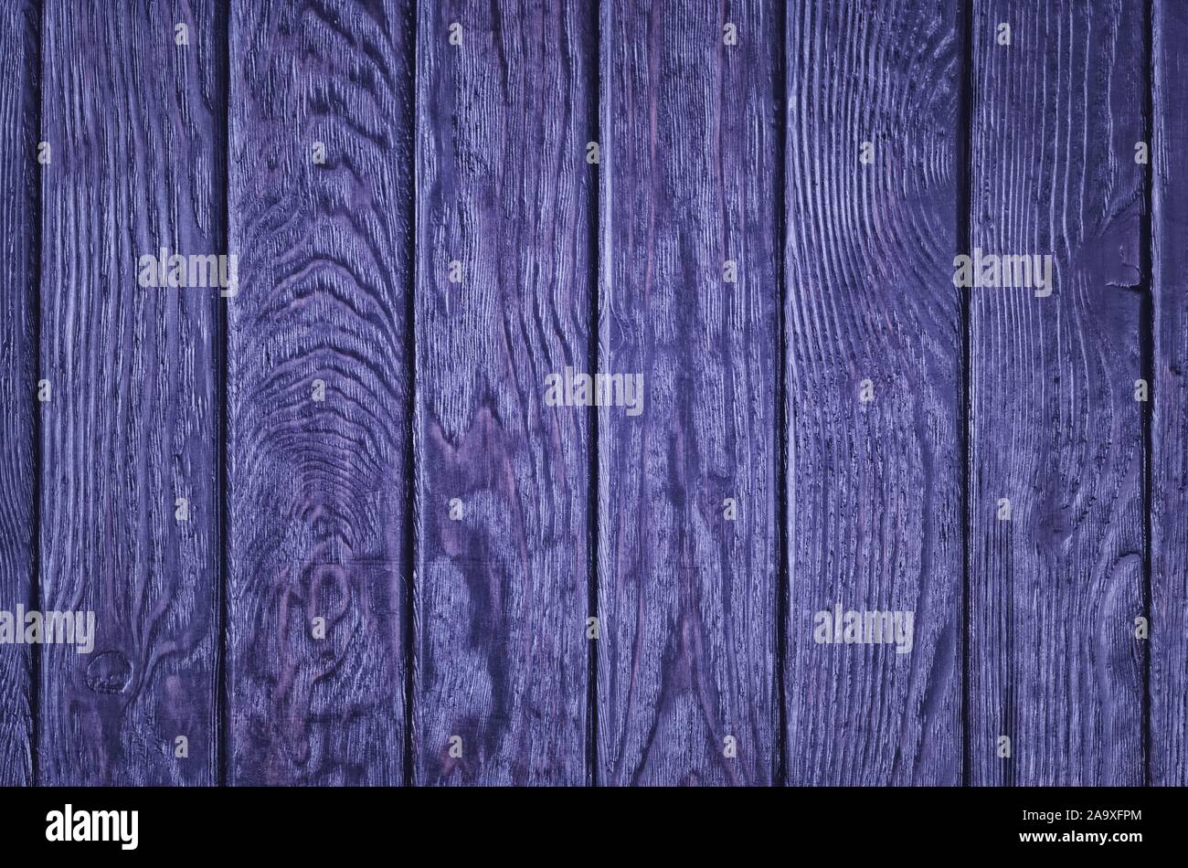 Wooden background texture. Creatively painted intense dark violet ...