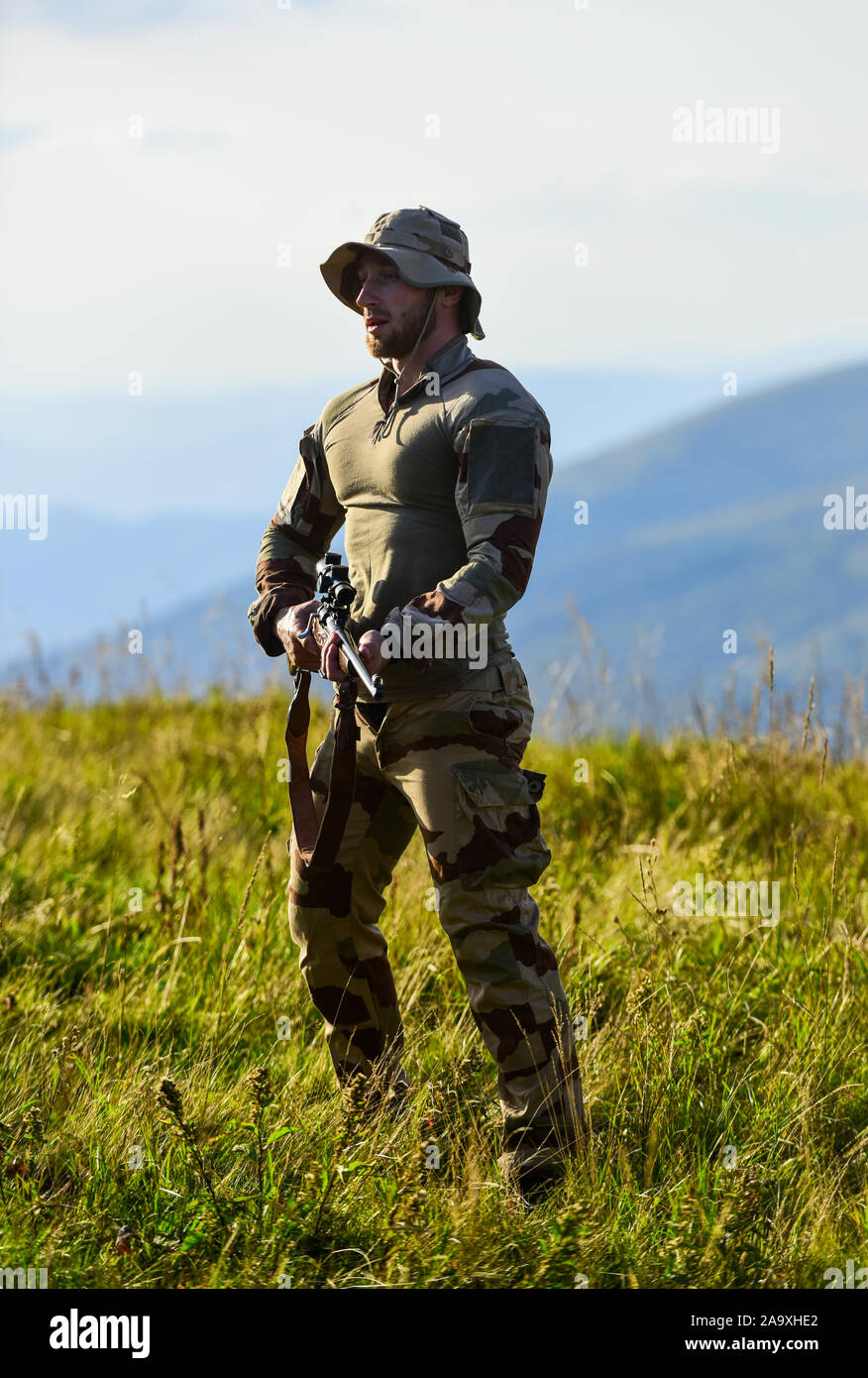 Focus and concentration experienced hunter. Ready to shoot. Army forces ...