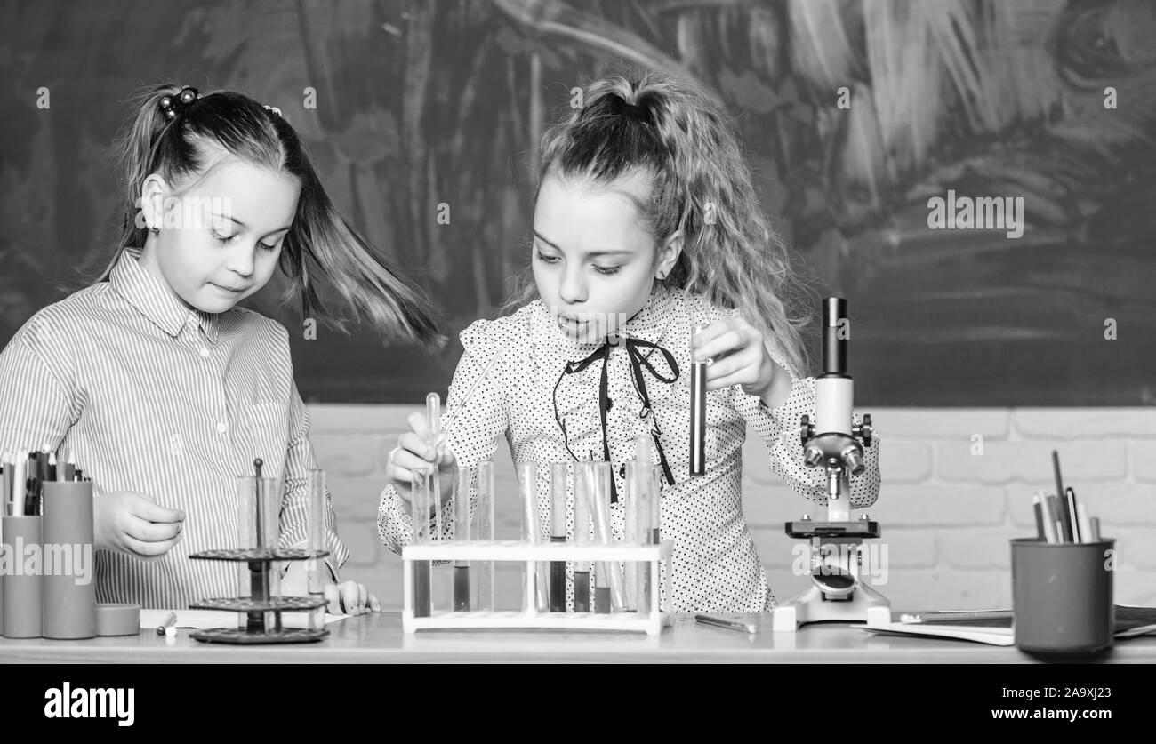 biology education. students doing biology experiments with microscope ...