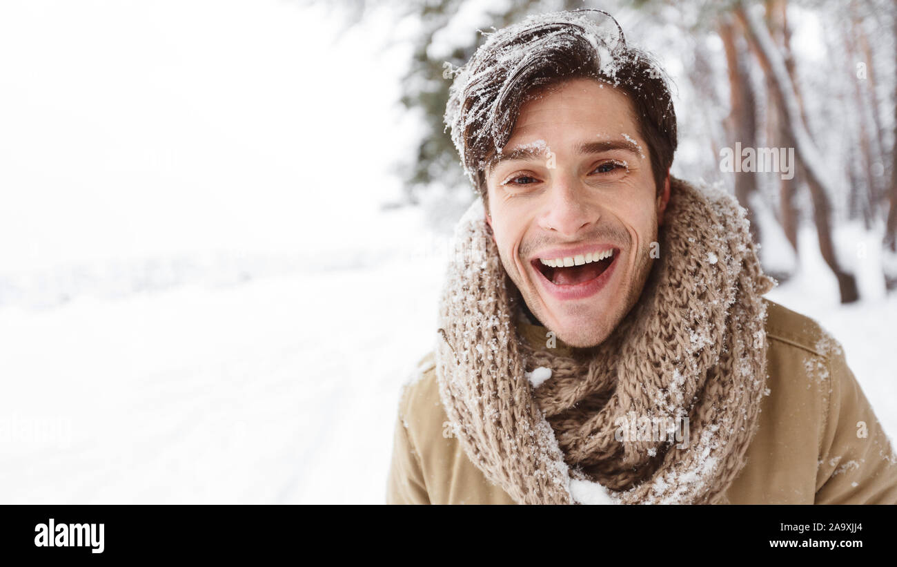 Happy Young Man Laughing Looking At Camera Enjoying Winter Outdoor ...