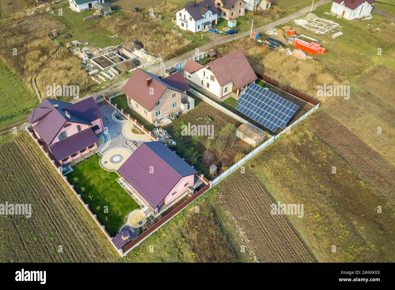 Aerial view of big blue solar panel installed on ground structure near ...