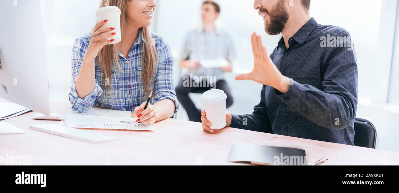 Colleagues discussing something during coffee hi-res stock photography ...