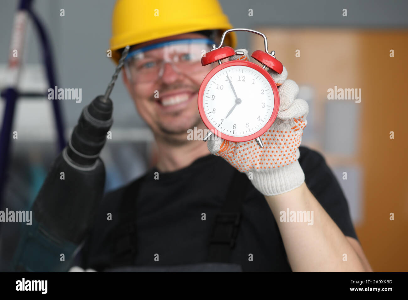Funny worker with drill Stock Photo - Alamy