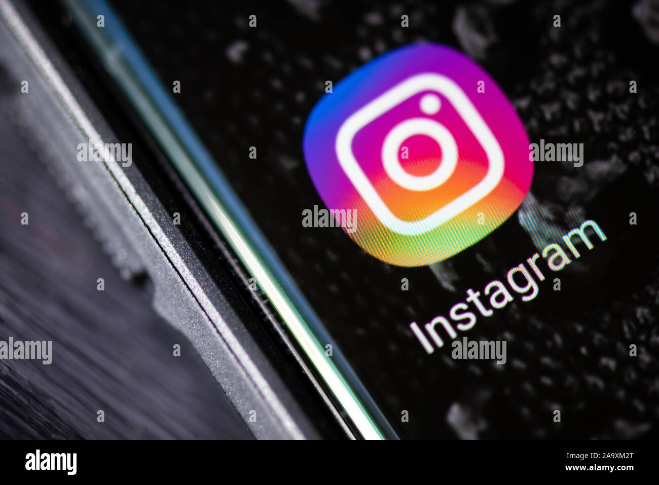 Instagram App on a smartphone, mobile device on a black background ...