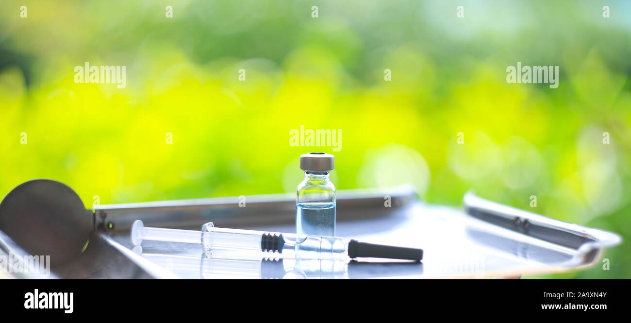 Vaccine vial dose flu shot drug needle syringe,medical concept ...