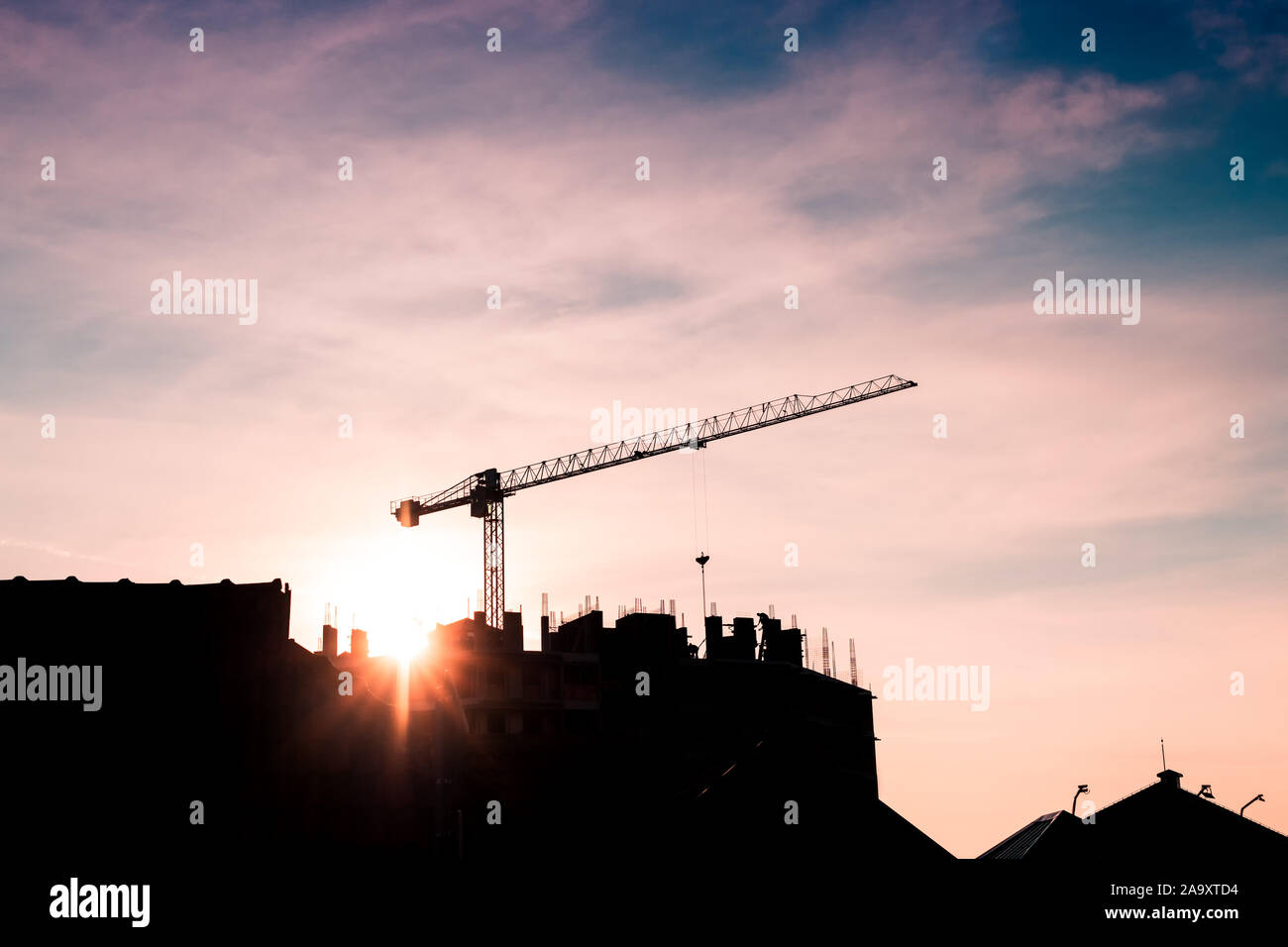 Construction workers sunset crane hi-res stock photography and images ...