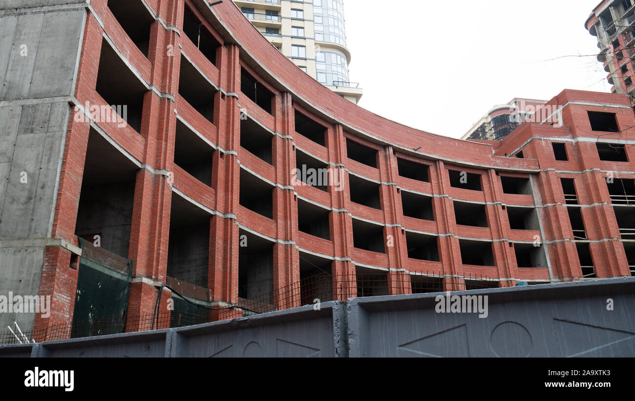 The construction of a large round brick building Stock Photo - Alamy