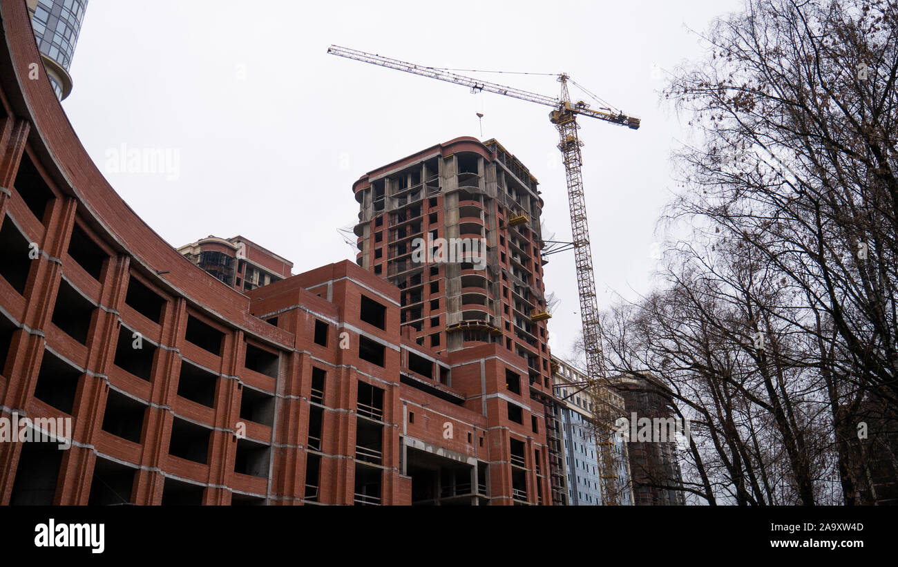 The construction of a large round brick building Stock Photo - Alamy
