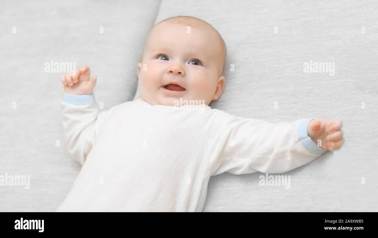 top view. beautiful baby lying on the couch Stock Photo - Alamy