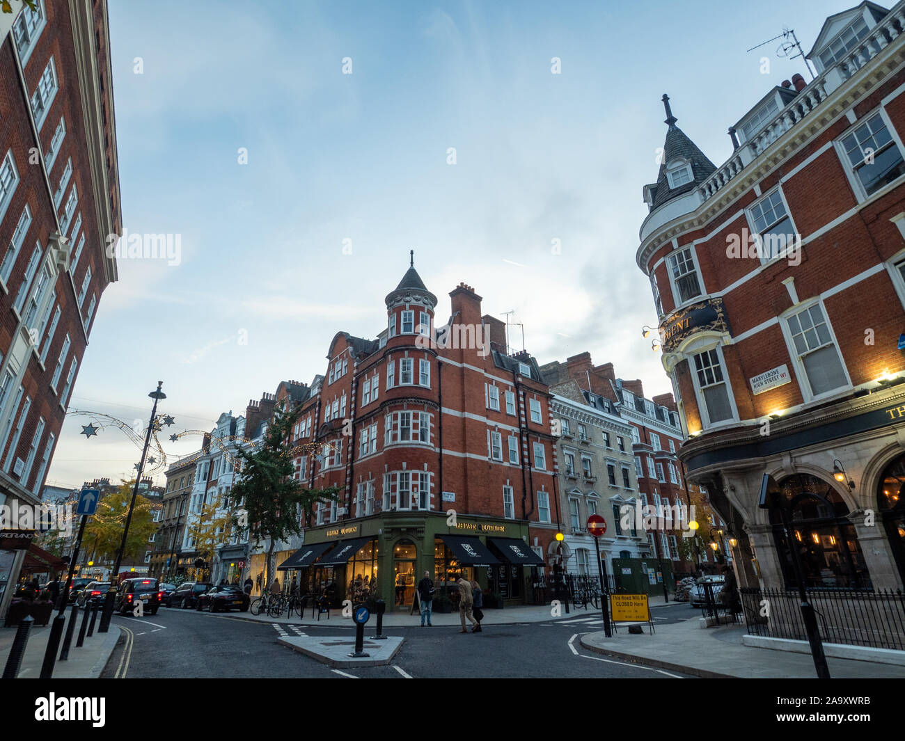 Marylebone High street approaching dusk with the shop lights on ...