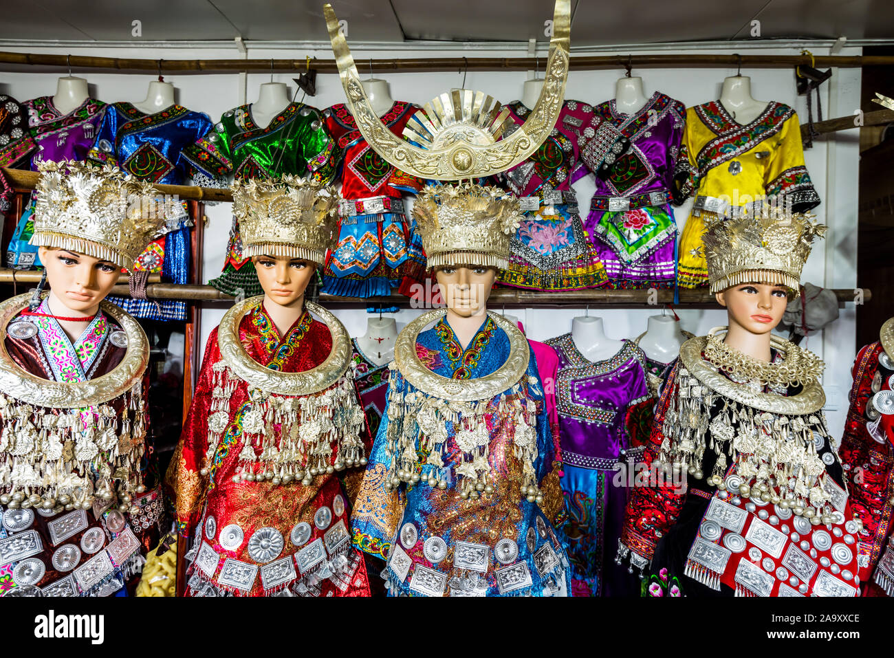 Traditional clothes on mannequins in the clothes shops of Xijiang ...