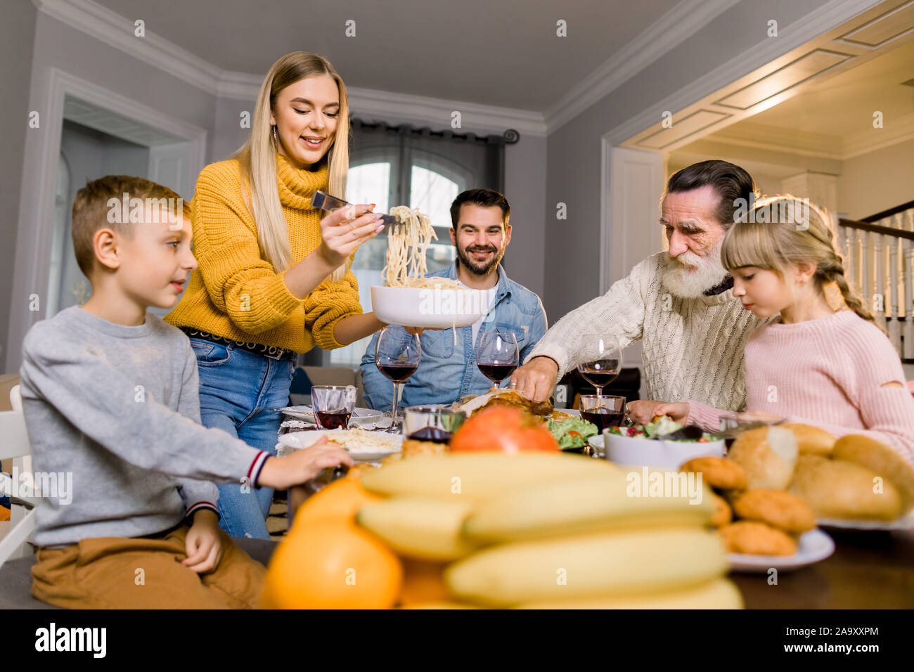 Nice family having tasty dinner. Food, thanksgiving day and leisure ...