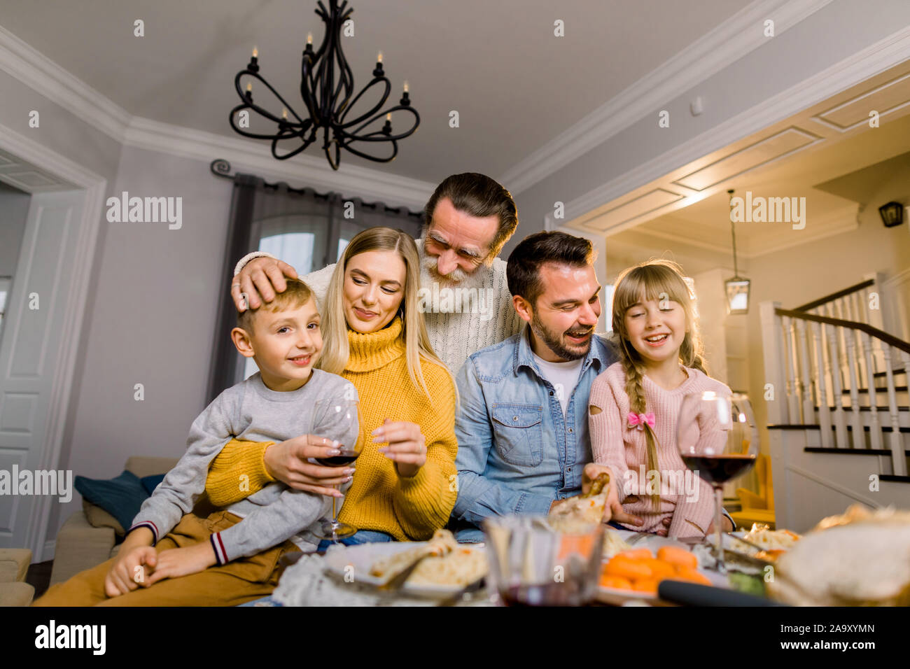 Nice evening, family gathering, meeting. Cheerful grey-haired ...