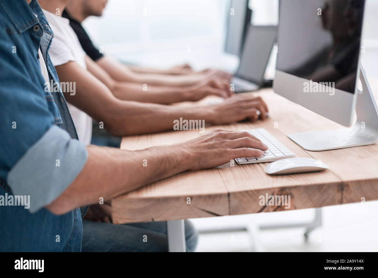 close up. a group of people work on their computers Stock Photo - Alamy