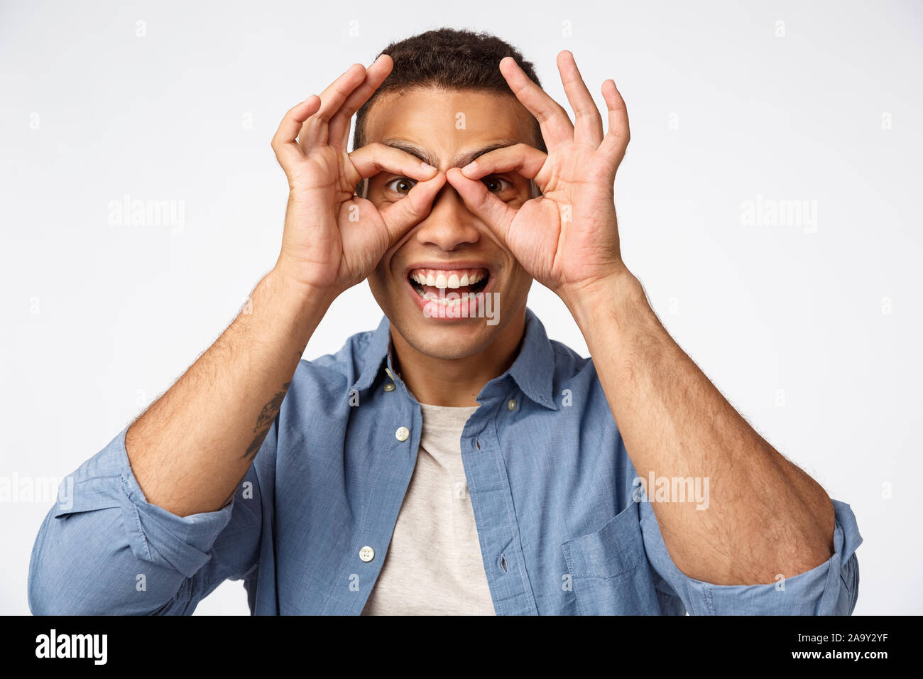 Man always be kids. Cheerful and funny young father fool around and ...