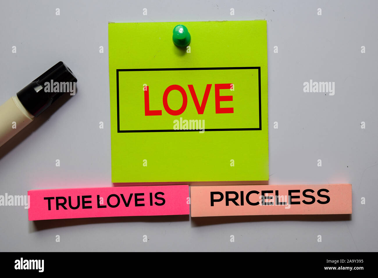 Love. True Love Is Priceless text on sticky notes isolated on office ...