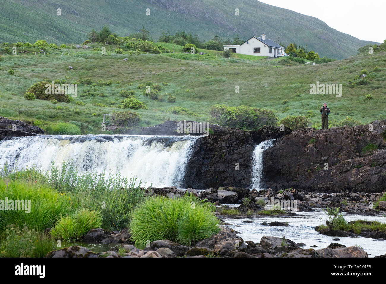 Ashleigh Falls, Mayo, Ireland. Connemara area, angler on a fishing ...