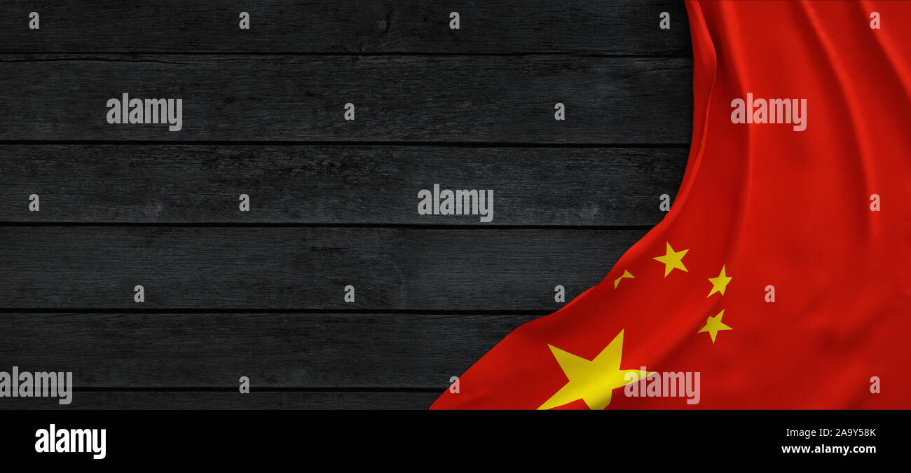 Flag of China, fabric on dark wood Stock Photo - Alamy