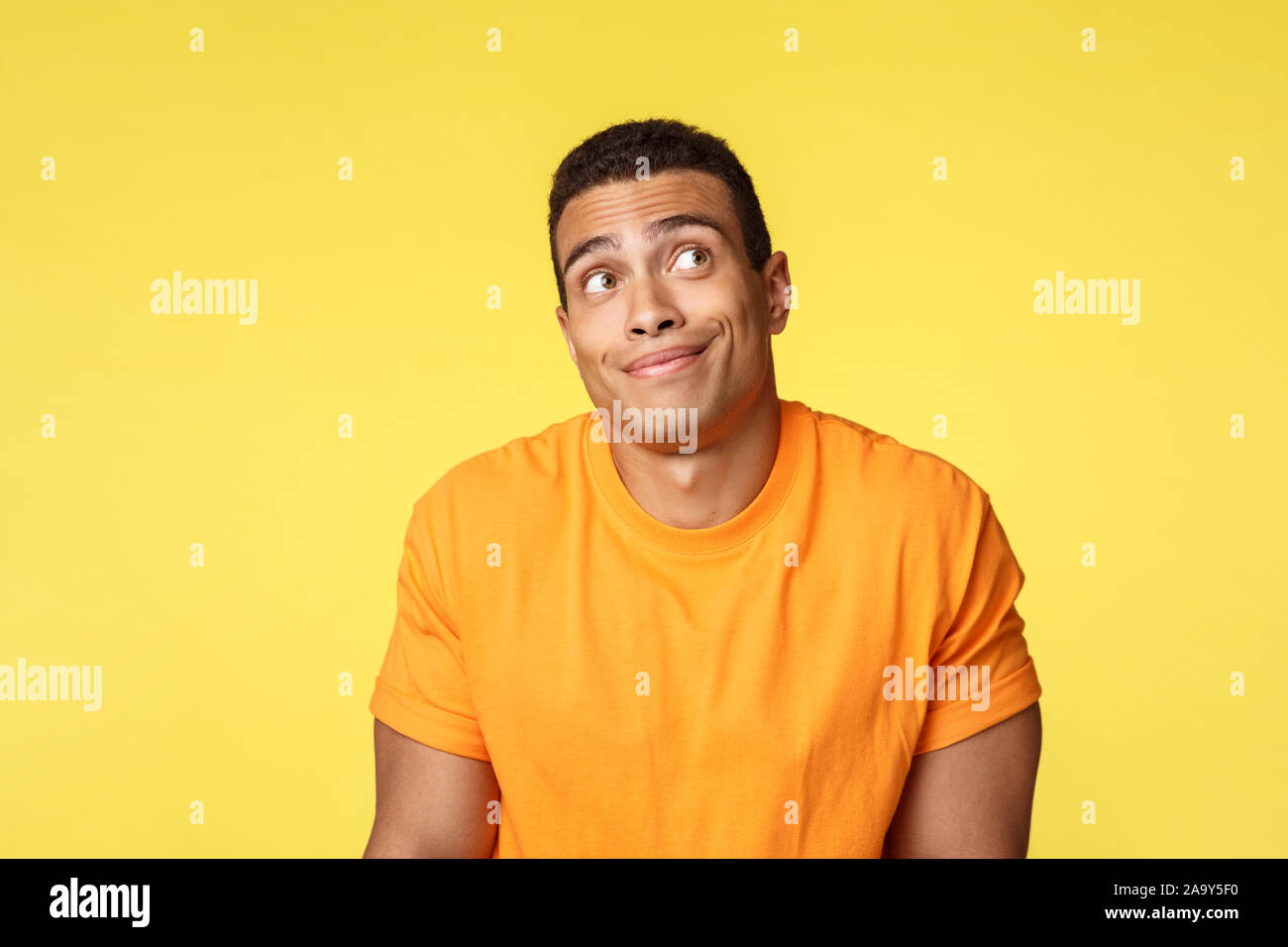 Unsure, careless and unbothered handsome brazilian guy in casual t ...