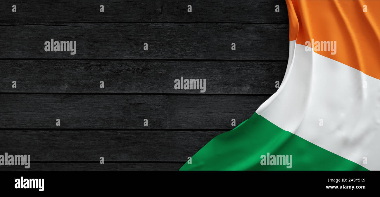 Flag of the Ireland, fabric on dark wood Stock Photo - Alamy