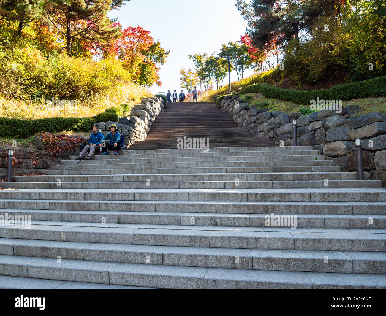 SEOUL, SOUTH KOREA, NOVEMBER 4, 2019: couple of elderly tourists rest ...
