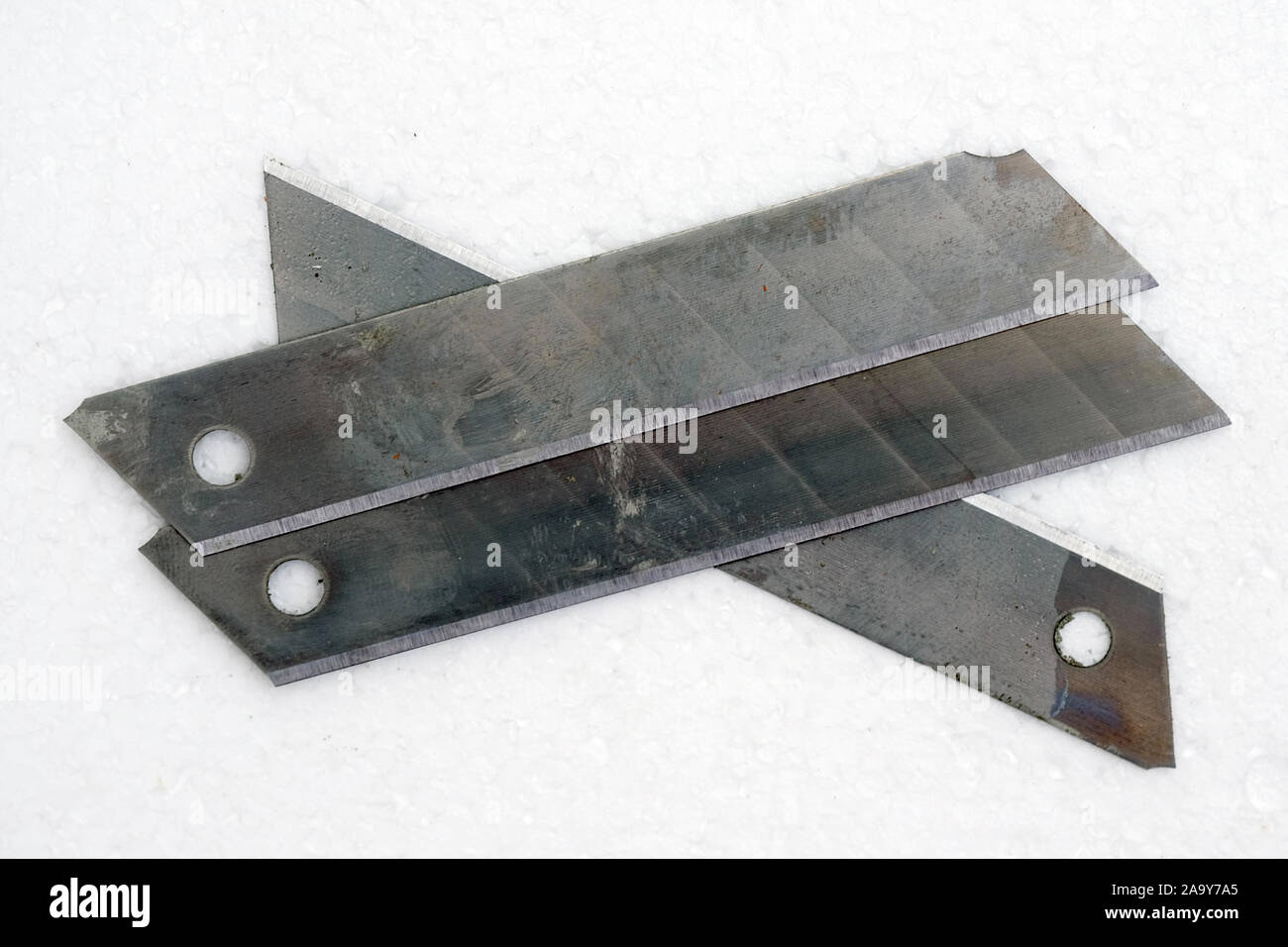 Blades for stationery knives, close-up. Segmented knife blades on a ...