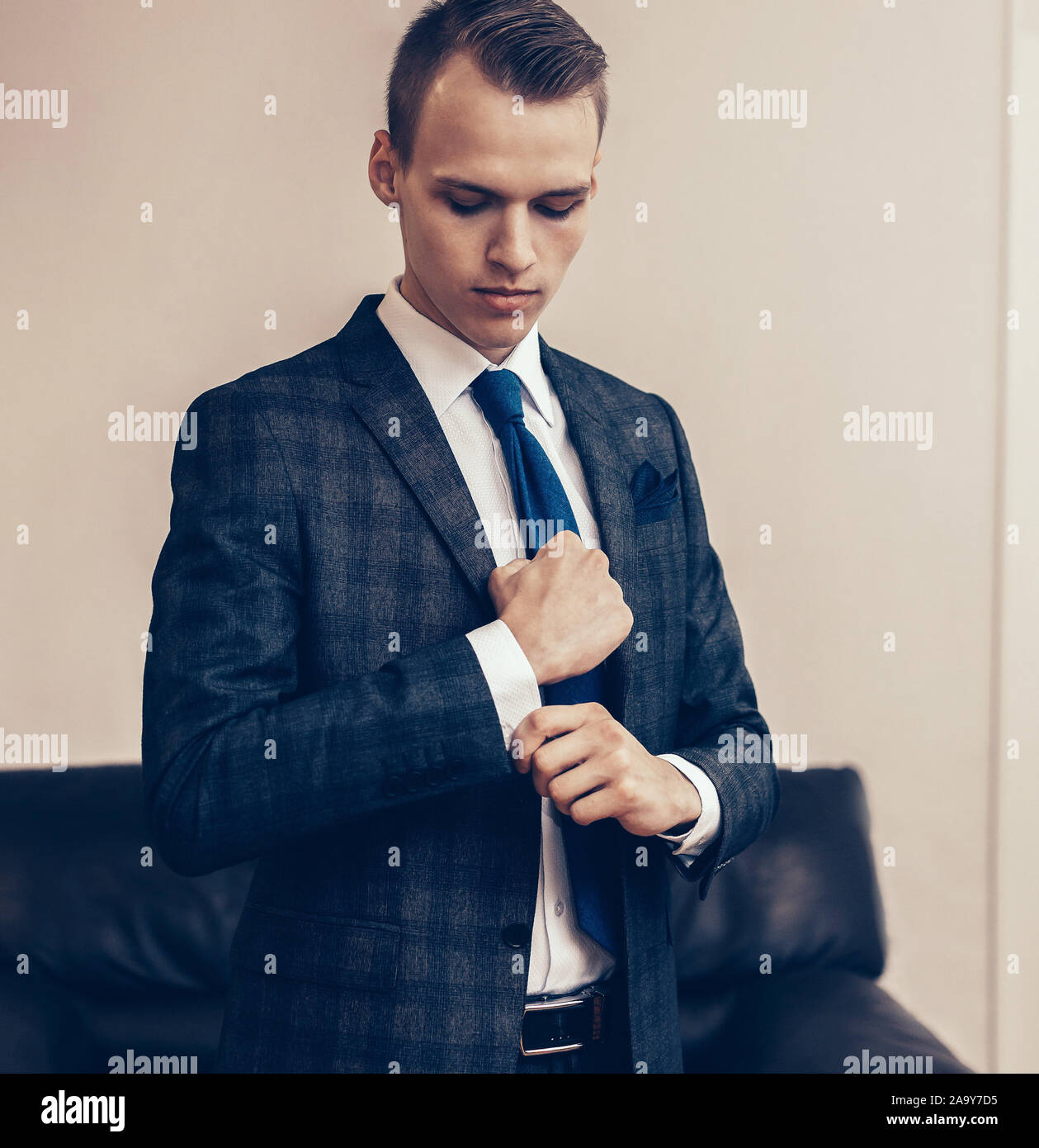 Adjusting cuffs hi-res stock photography and images - Alamy