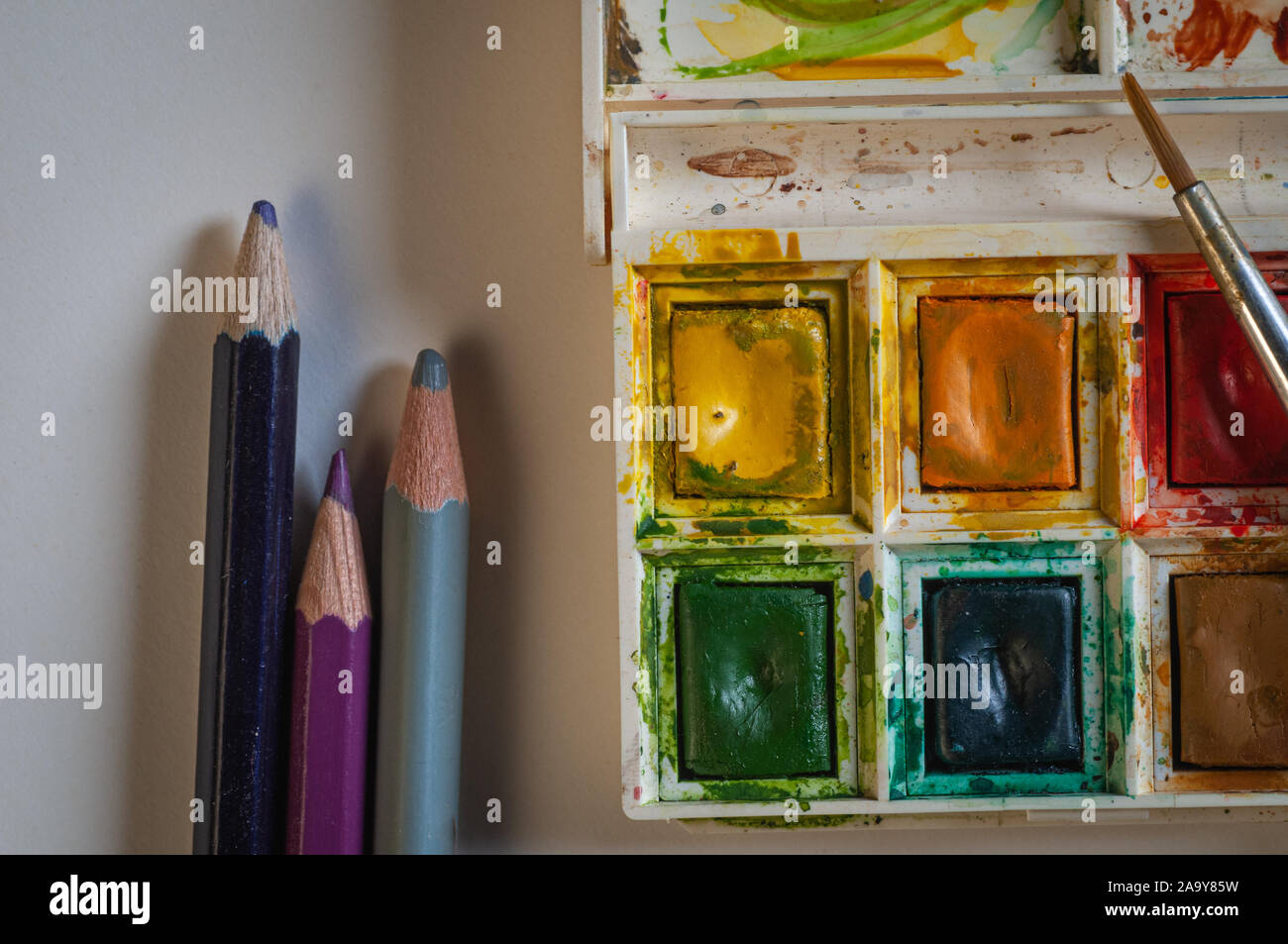 messy box of watercolour paints and brush ,close up with pencils Stock ...