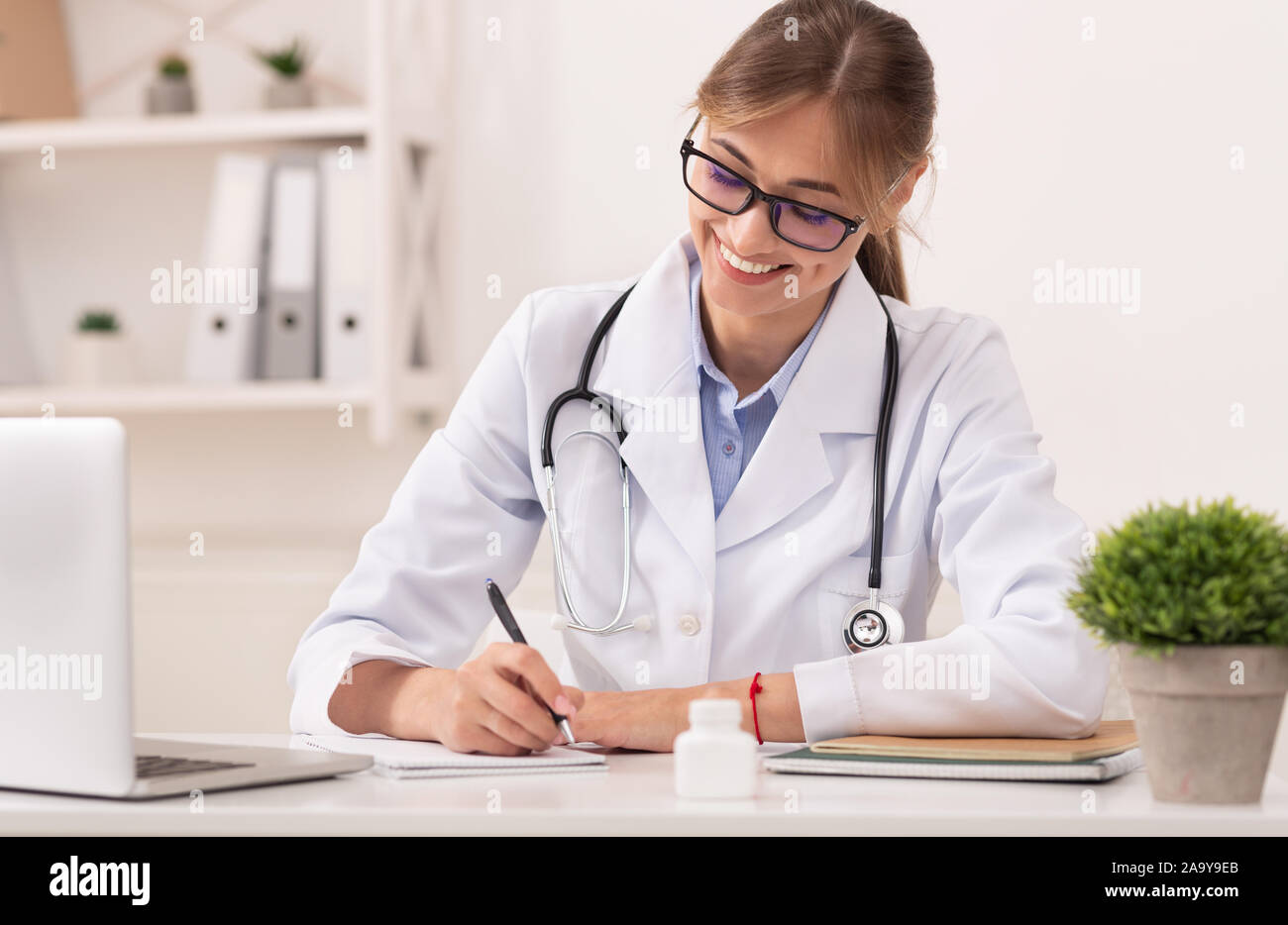 Smiling Doctor Lady Prescribing Medication Treatment Sitting At ...