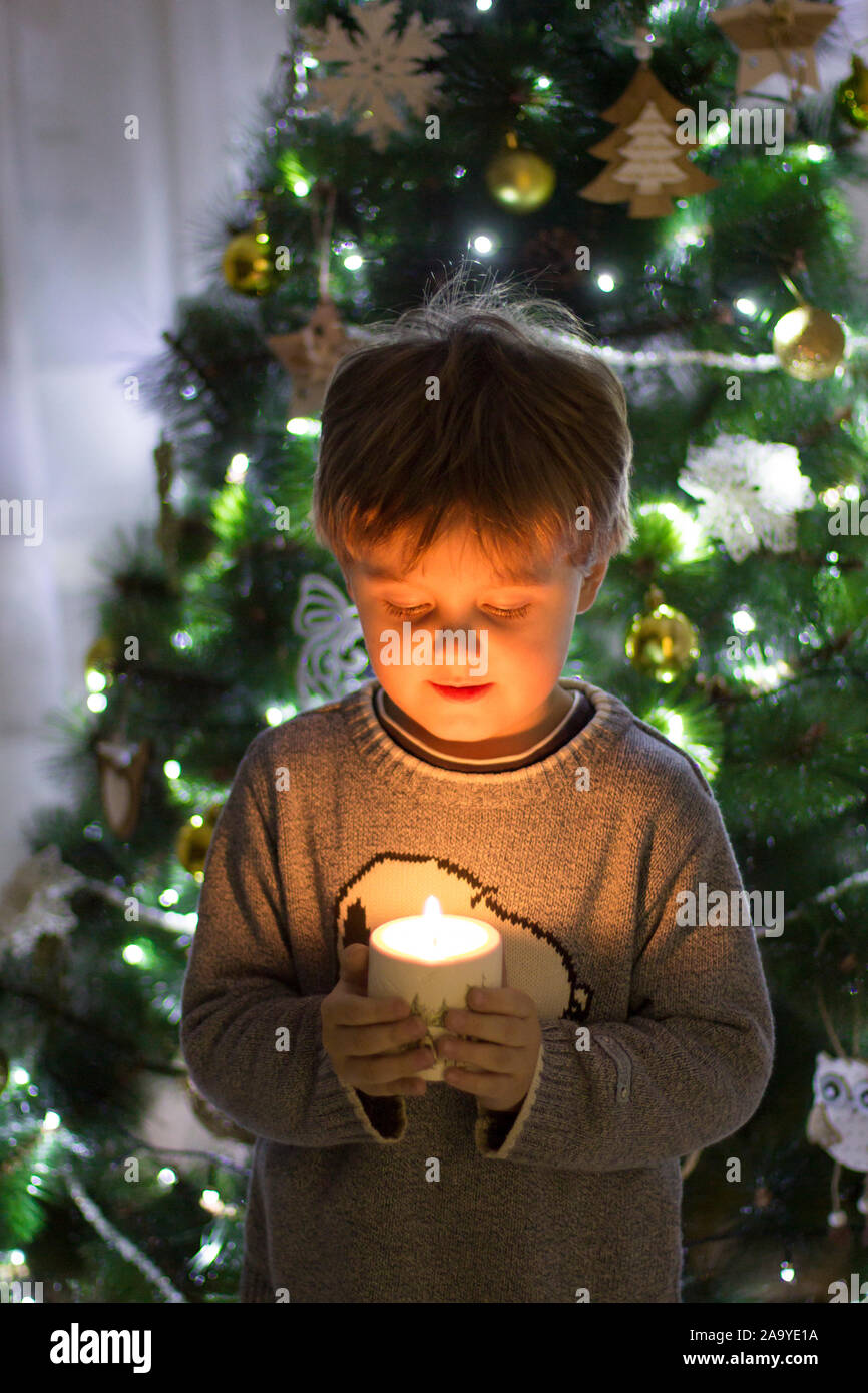 Light candle boy hi-res stock photography and images - Alamy