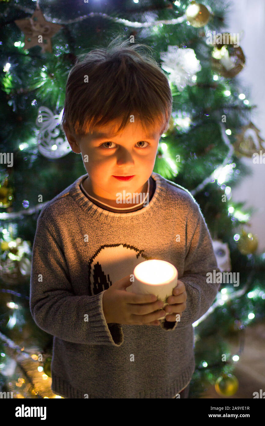 Light candle boy hi-res stock photography and images - Alamy