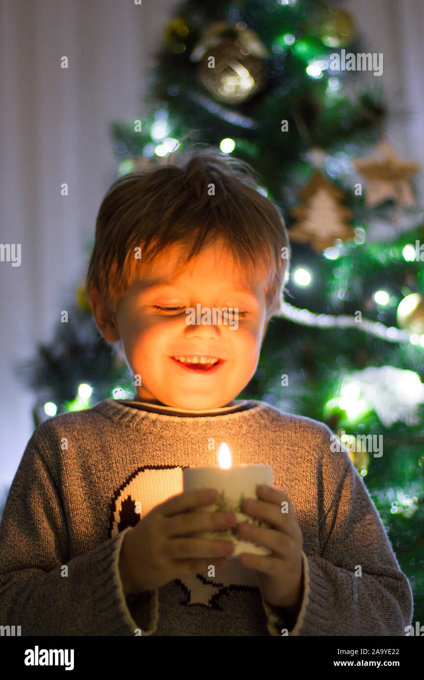 Light candle boy hi-res stock photography and images - Alamy