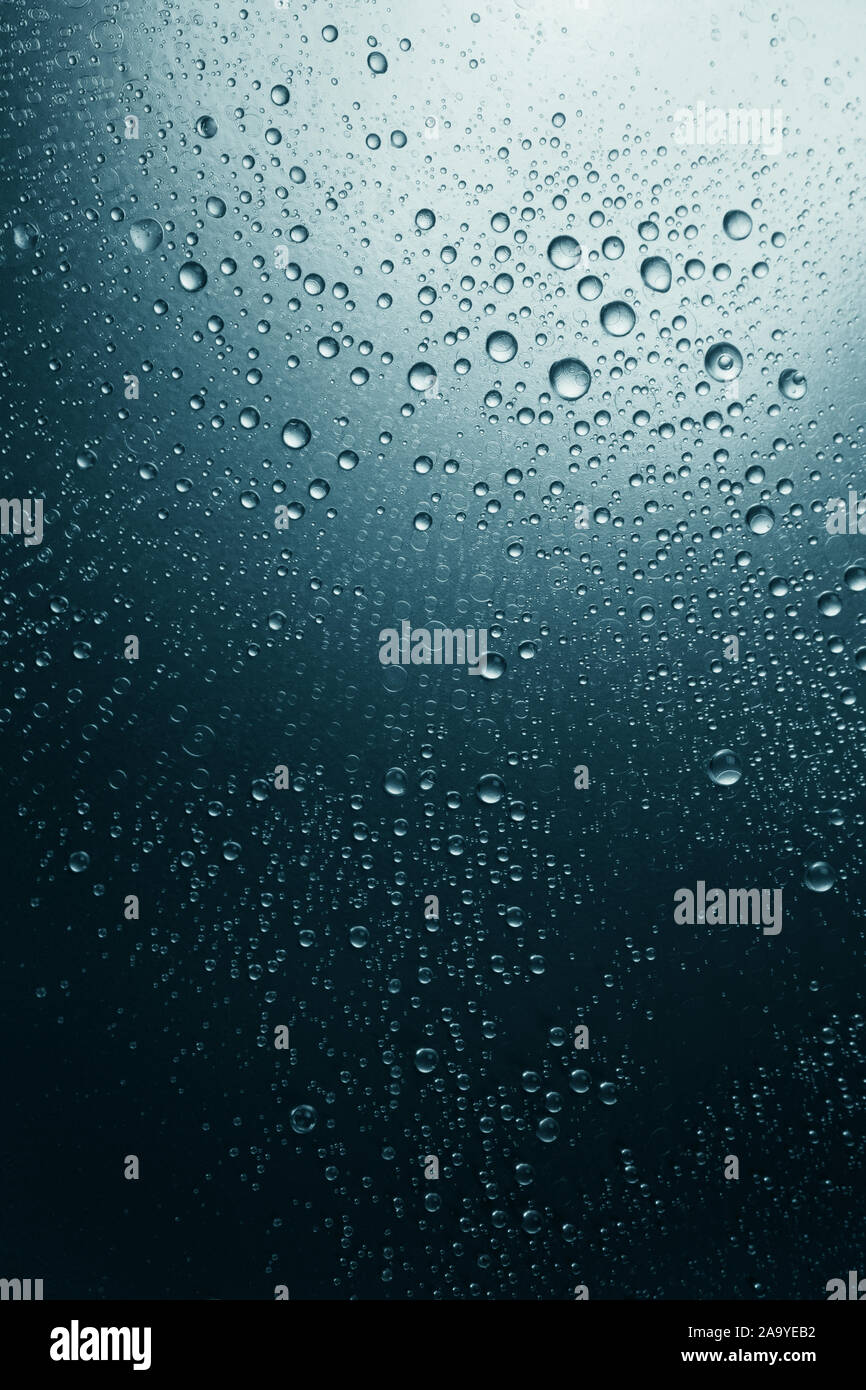 Background of shining water drops on blue surface, macro Stock Photo ...