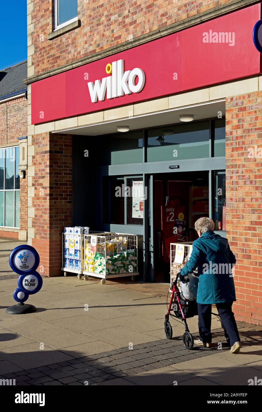 Elderly lady walking past Wilko store in Selby, North Yorkshire ...