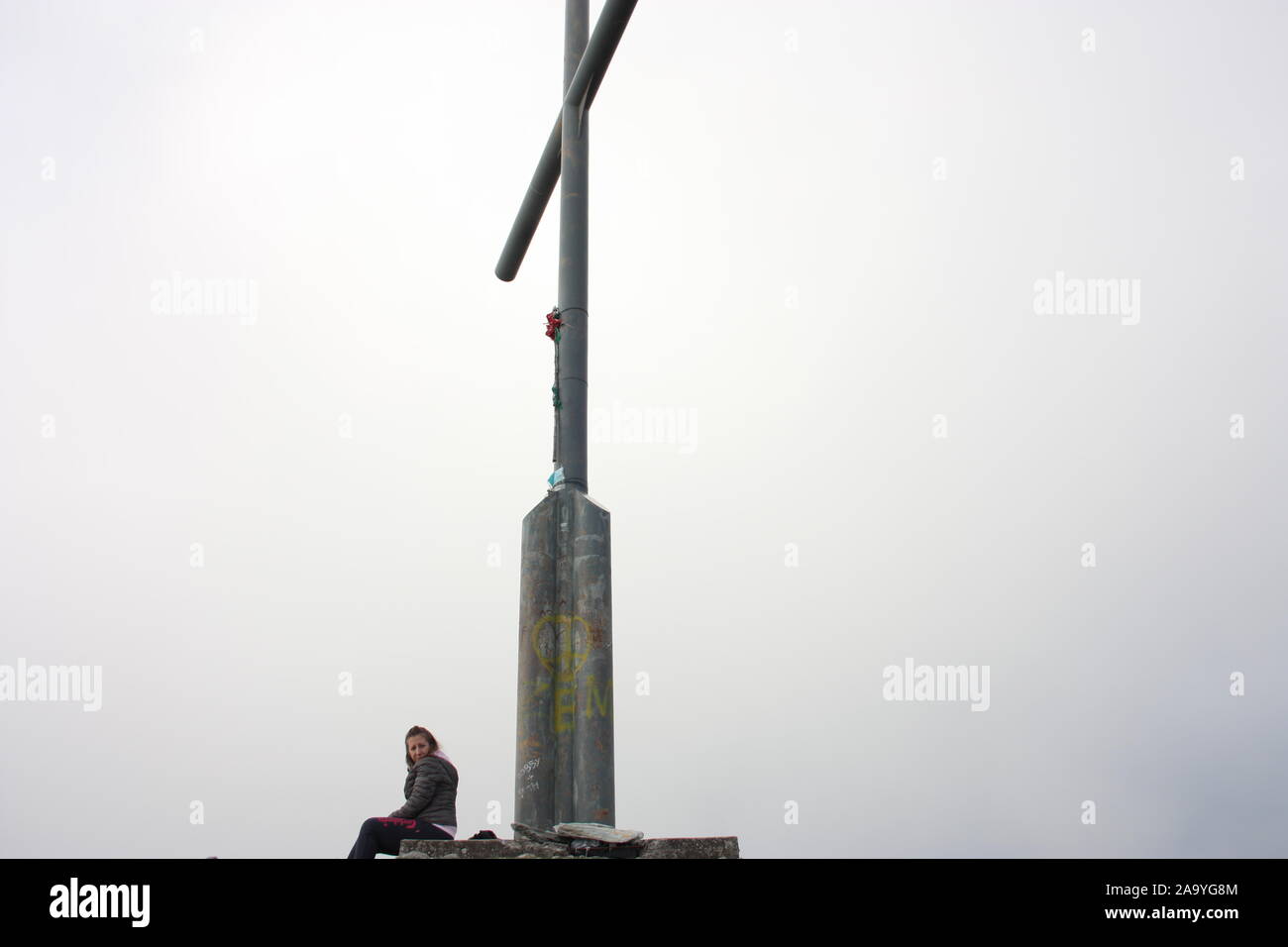 selective focus. out of focus. girl sitting in thick and dense fog ...