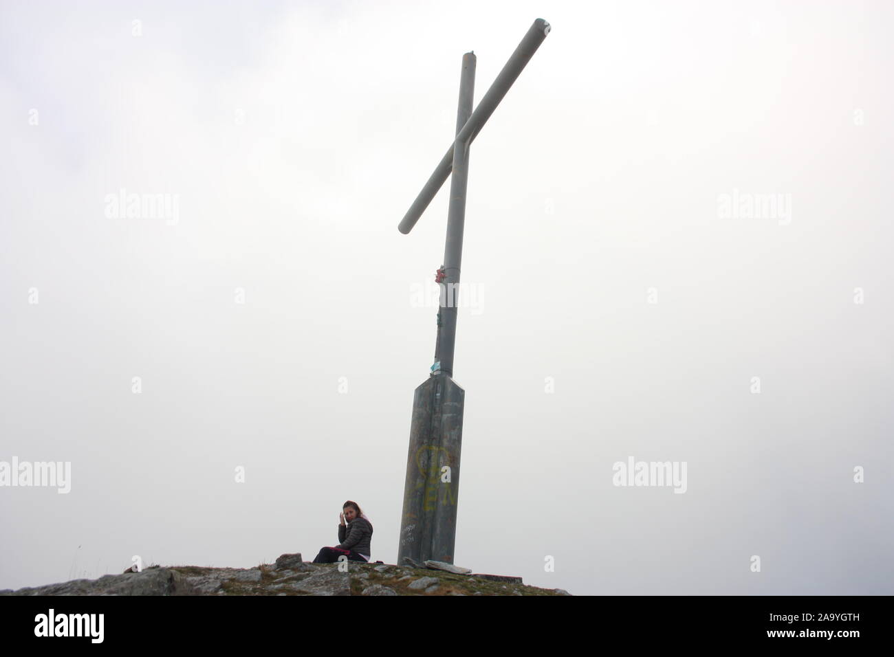 selective focus. out of focus. girl sitting in thick and dense fog ...