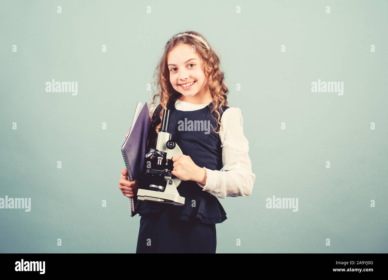 science research in lab. Small genius girl with microscope. education ...